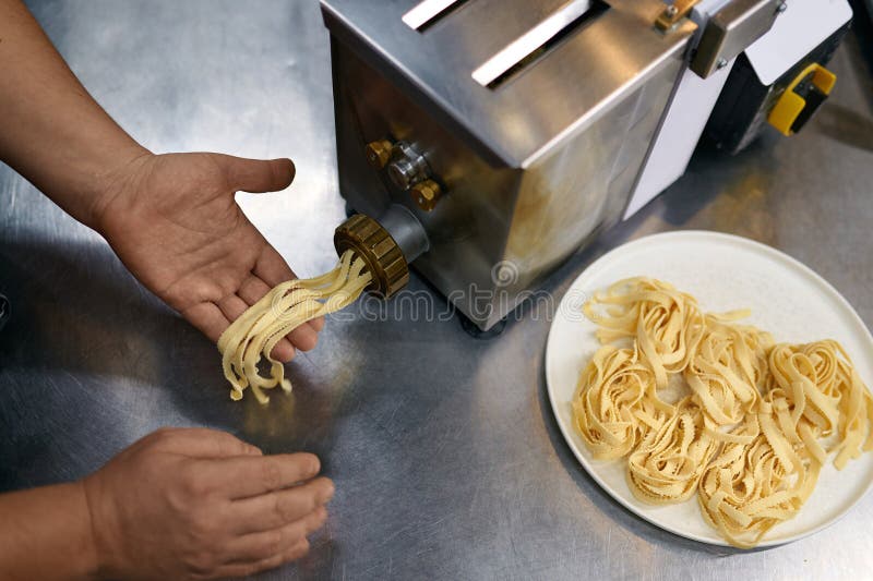Closeup Chef Using Pasta Maker on Restaurant Kitchen Stock Image ...