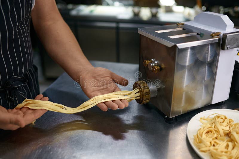 Closeup Chef Using Pasta Maker on Restaurant Kitchen Stock Image ...