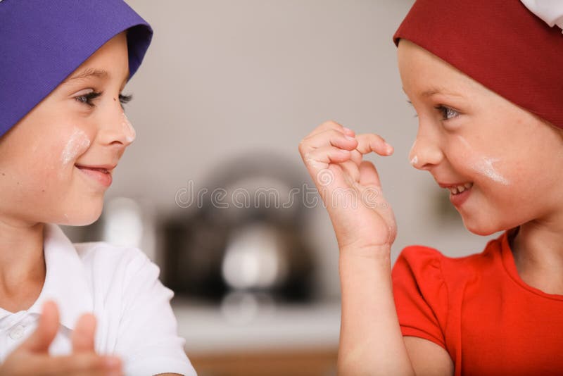 Closeup of Children Making Cakes and Smiling. Stock Image - Image of ...