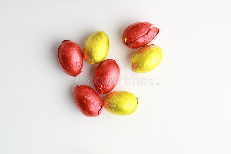 Closeup of Chocolate Easter Egg Candies Wrapped in Yellow and Red Paper ...