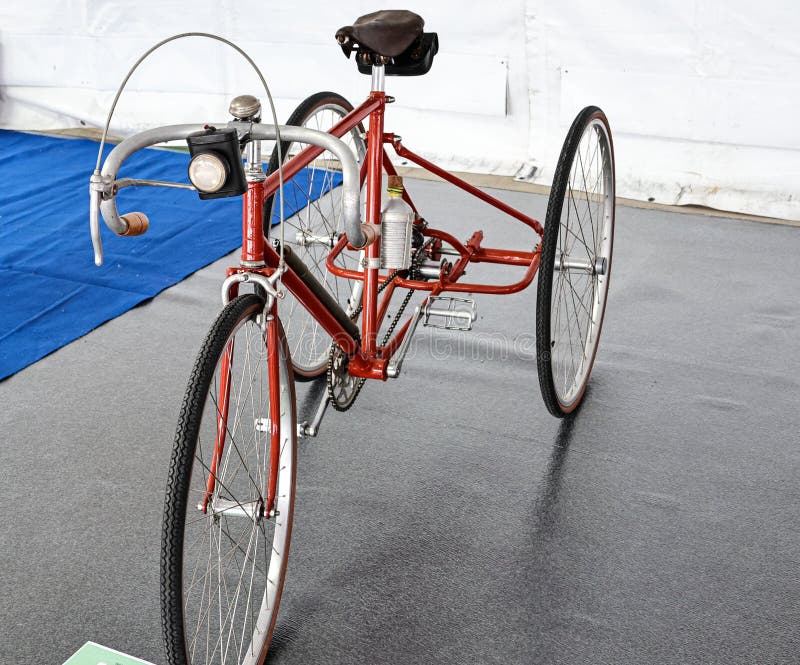 Closeup of a Classic Red Retro Bike with Two Wheels on the Back Stock ...