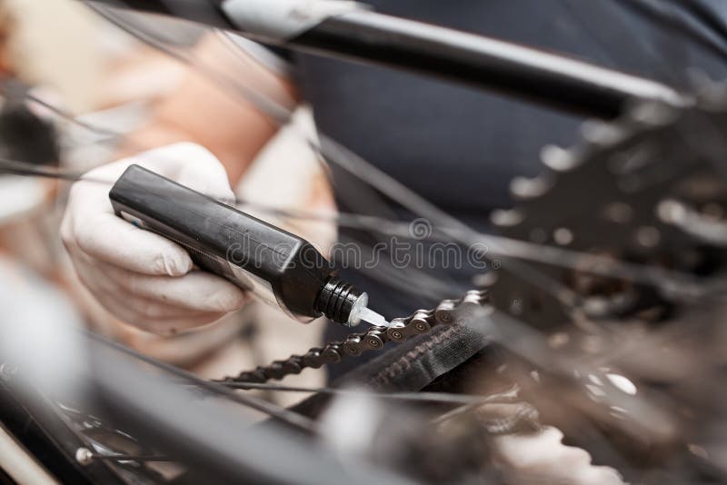 Cleaning and Oiling a Bicycle Chain and Gear with Oil Stock Image ...