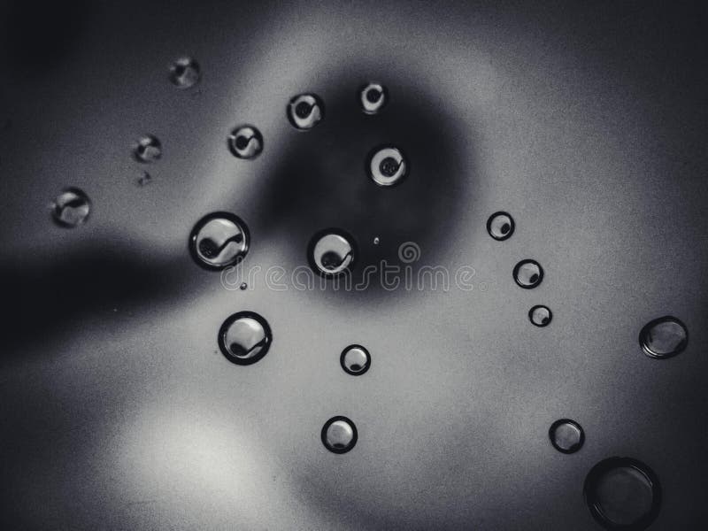 Closeup of Clear Bubbles Floating in the Air on a Dark Grey Background ...