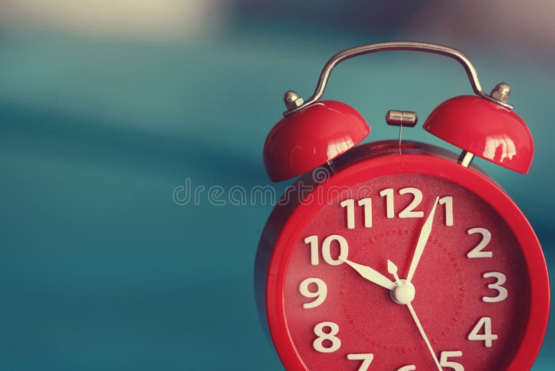 Closeup on Clockwise. Face of Red Alarm Clock at 10 O`clock Stock Photo ...