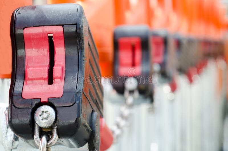 Closeup of a Coin Lock of a Trolley Under the Lights with a Blurry ...