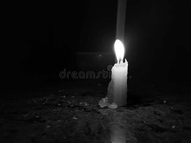 Color and Black & White Candle Light in a Dark Black Background Stock ...