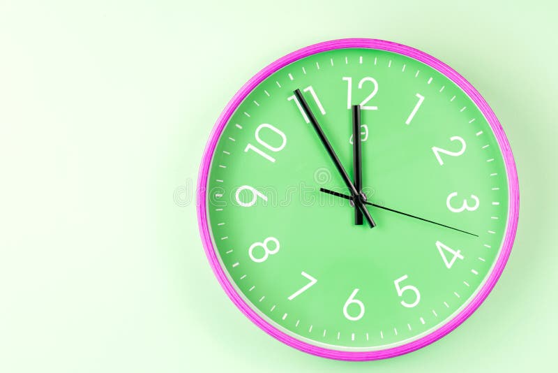 Closeup of Colorful Wall Clock on Green Background. Minimalist Flat Lay ...