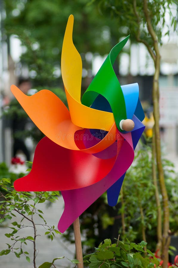 Colorful Wind Turbine in a Garden Stock Photo - Image of plant, garden ...