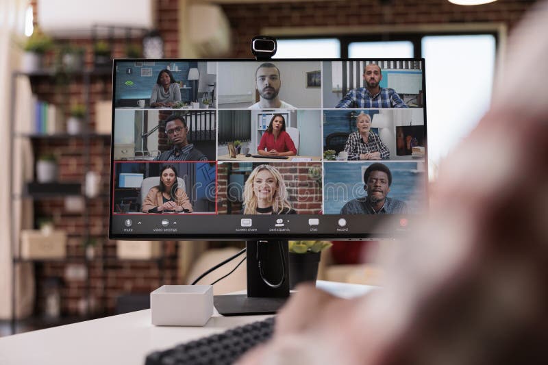 Closeup of Computer Screen with Video Call Software App Showing Team of ...