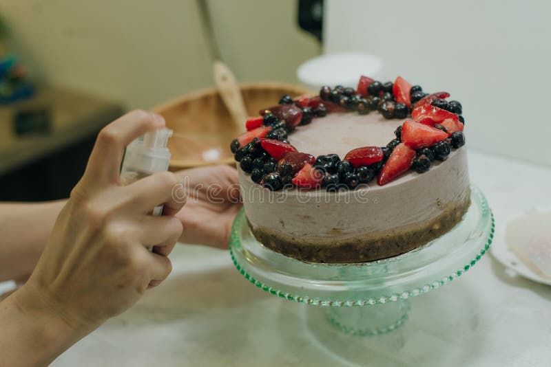 Closeup Confectioner Decorates the Cake with Velor Using the Spray ...