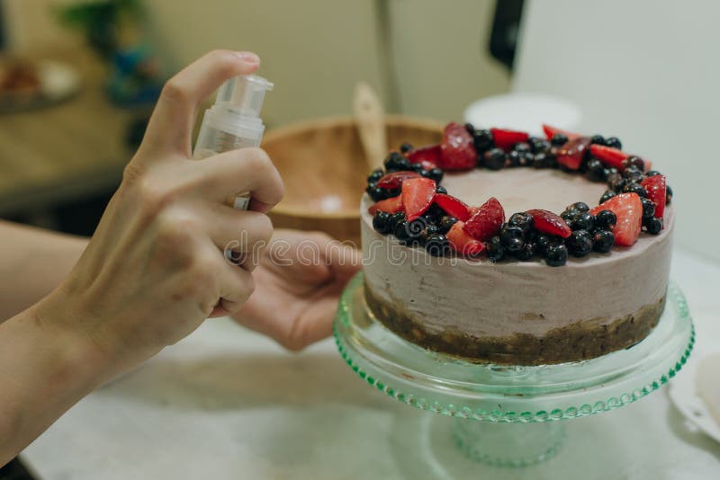 Closeup Confectioner Decorates the Cake with Velor Using the Spray ...