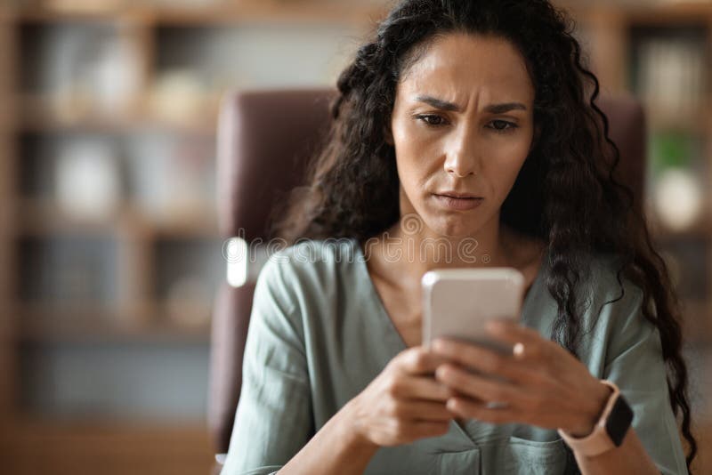 Closeup of Confused Woman Looking at Cell Phone Screen Stock Photo ... Closeup of Confused Woman Looking at Cell Phone Screen Stock Photo ...