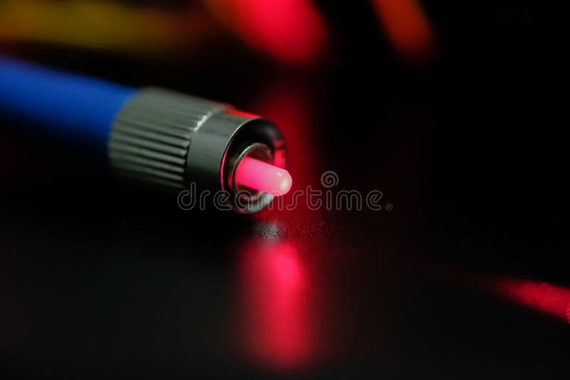 Closeup of Connectors of Optical Fiber Network Cable. the Laser Shines ...