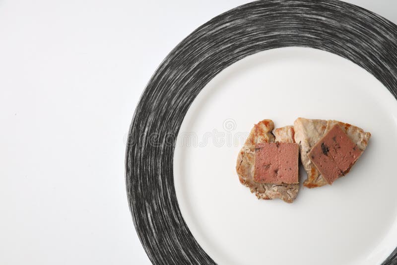 Closeup of Cooked Pork Pieces with Foie on Plate Stock Image - Image of ...