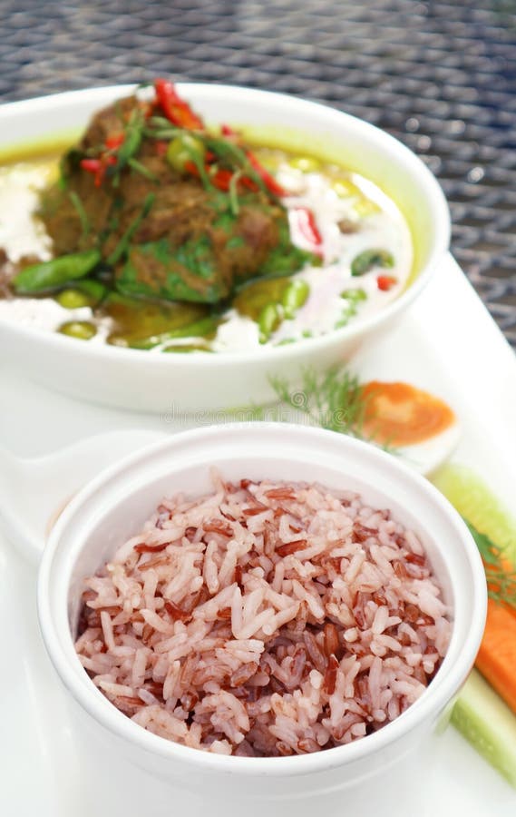 Cooked Thai Red Cargo Rice Served with Thai Green Curry Stock Image ...