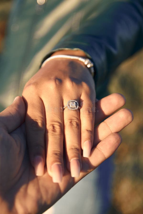 Closeup of a Couple Holding Hands and Showing the Ring Stock Photo ...