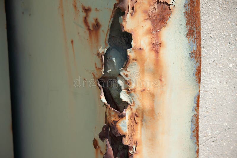Closeup of a Cracked Rusty Pillar on a Background of Gray Wall Stock ...