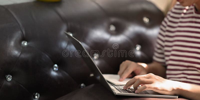 Closeup Creative Man Typing on Computer Laptop that Putting on His Lap ...