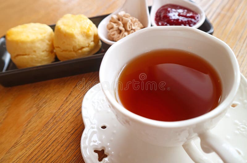 Cups of Hot Tea with Plate of Scones in the Backdrop Stock Photo ...