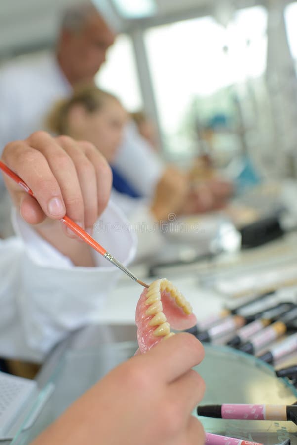 Technician in Dental Lab Working Under Microscope Stock Photo - Image ...