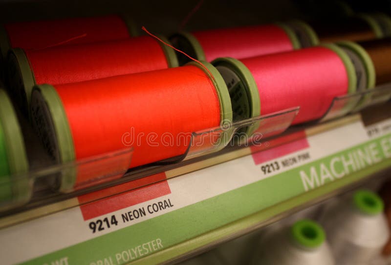 Closeup Detail of Neon Colored Spools of Thread on Display Stock Image ...