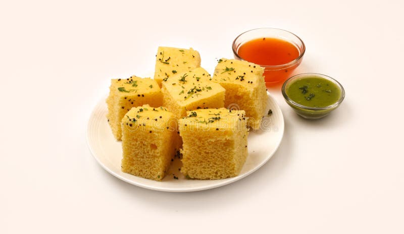 Closeup of Dhokla Gujarati on a White Plate with Two Sauces on the Side ...