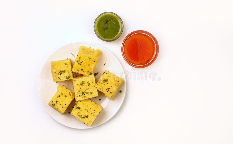 Closeup of Dhokla Gujarati on a White Plate with Two Sauces on the Side ...