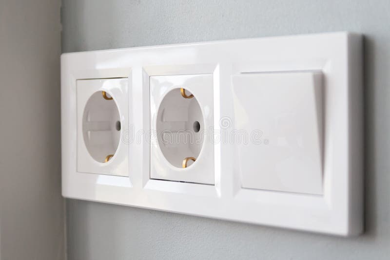 A Closeup Diagonal View of a Group of White European Electrical Outlets ...