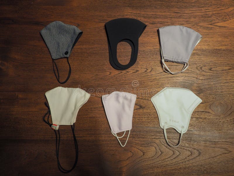 Closeup of Different Style of Face Masks on the Wooden Table Stock ...