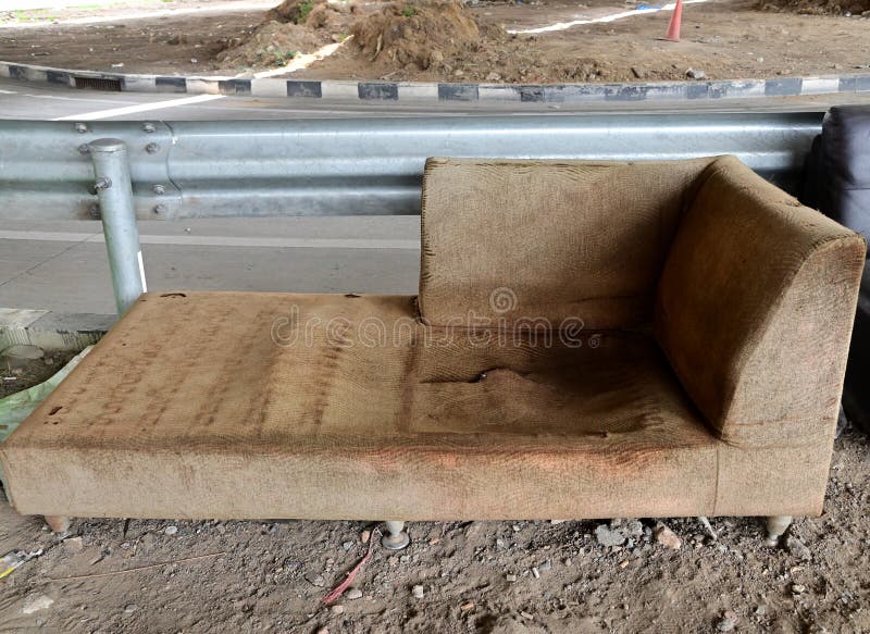 Dirty Old Colorful Sofa is Left with Garbage on the Side of the Road ...