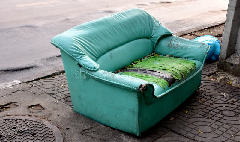 Dirty Old Colorful Sofa is Left with Garbage on the Side of the Road ...