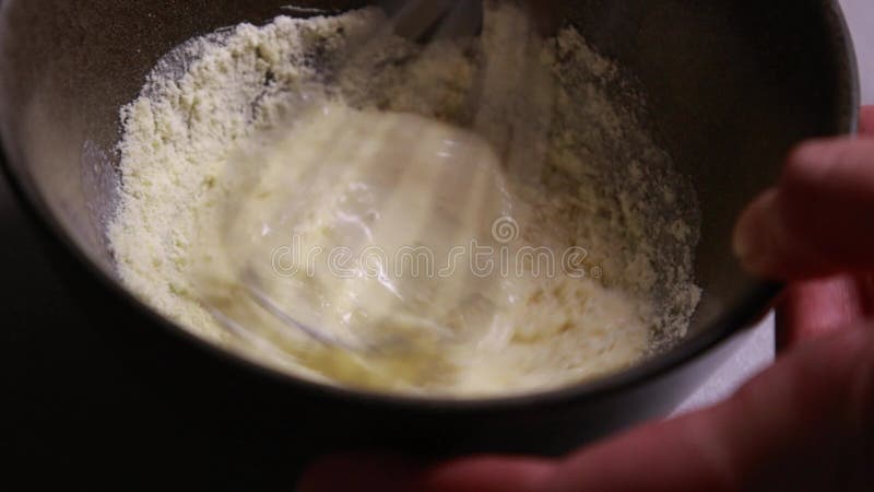 CloseUp of Dissolving Cornstarch in Milk in a Small Bowl Stock Footage ...