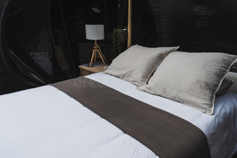 Closeup of a Double Size Bed with Pillows and Bedsheets on it Under the ...