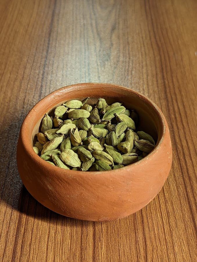 Closeup of Dried Cardamom in the Wooden Plate, Wooden Background Stock ...
