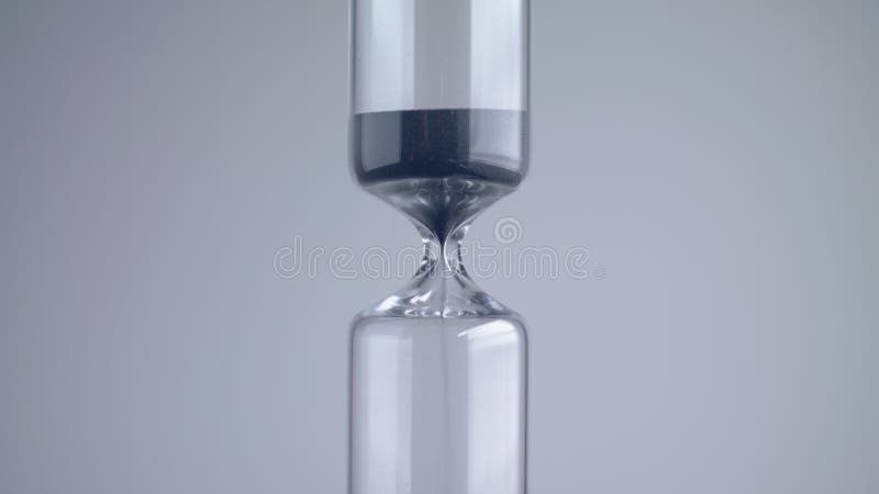 Closeup of Dynamic Sand Falling in the Hourglass Isolated on Gray ...