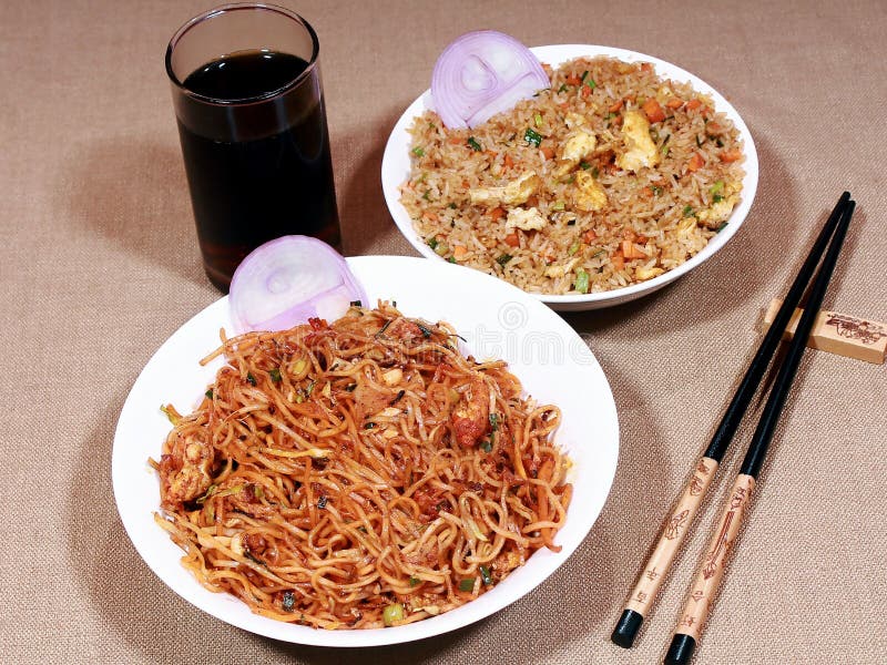 Closeup of Egg Schezwan Noodles and Egg Fried Rice Stock Photo - Image ...