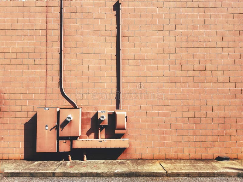 Closeup of Electrical Fuse Boxes on a Brown Brick Wall Stock Photo ...