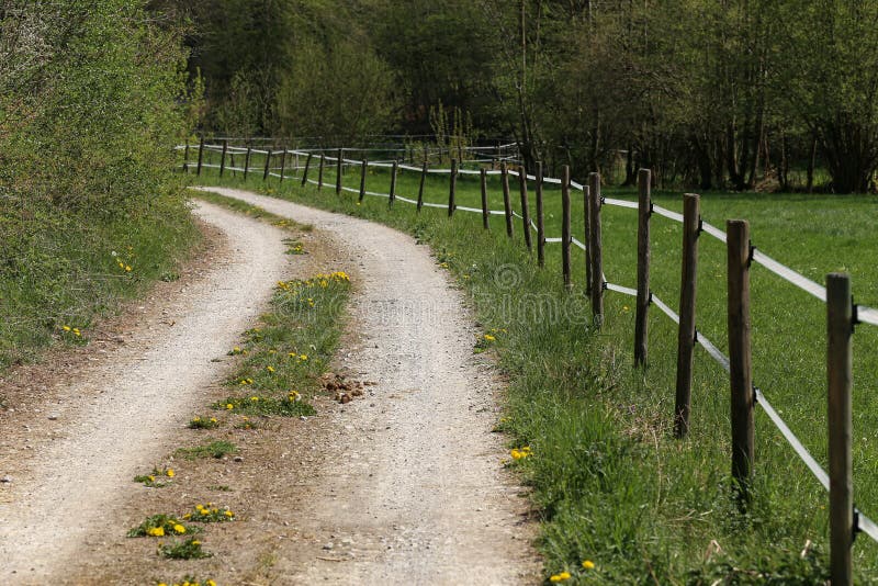 Closeup of an Electrical Wire Fence Around a Pasture Parallel To the ...