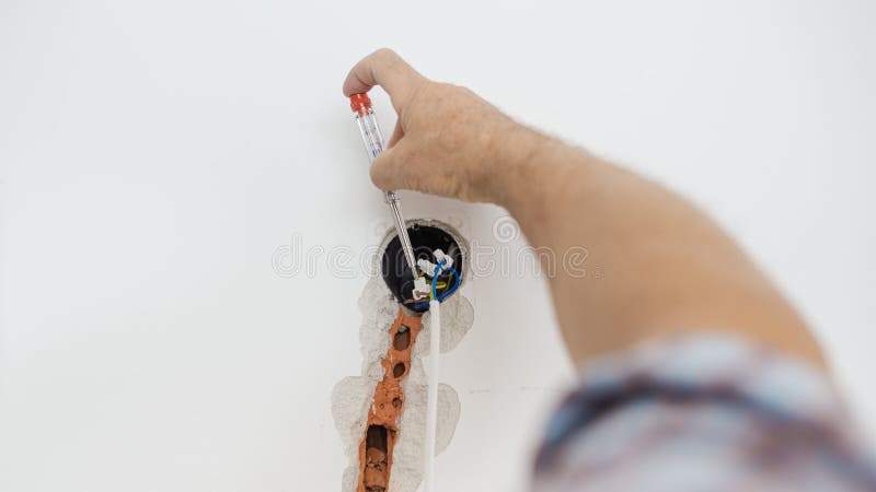 Electrician Checking Electrical Current in a Wire Stock Image - Image ...