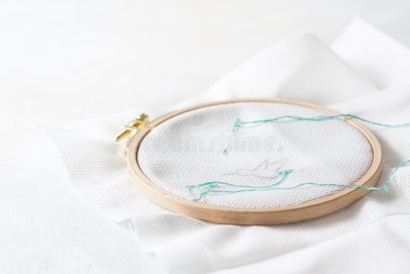 Closeup of an Embroidery Process, a Green Thread in a Needle. Wooden ...