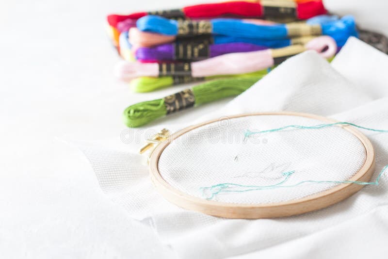 Closeup of an Embroidery Process, a Green Thread in a Needle. Wooden ...