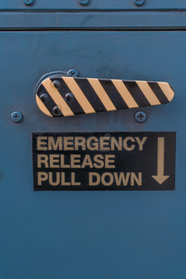 Closeup of "EMERGENCY RELEASE PULL DOWN" Written on a Transport Stock ...