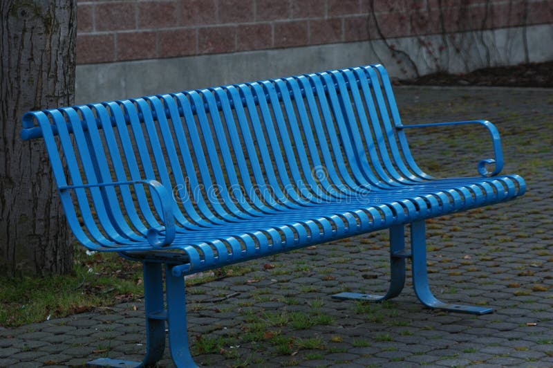 Closeup of an Empty Blue Bench on the Cobblestone Ground Stock Photo ...