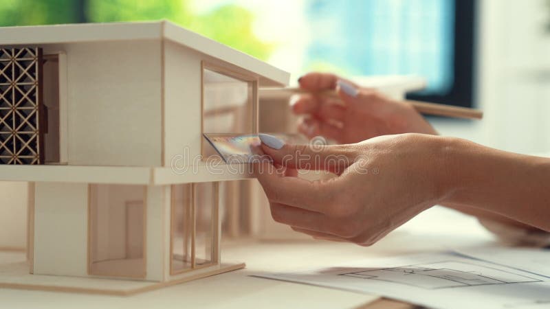 Closeup of Engineer Hand Measure House Model and Write on Blueprint ...