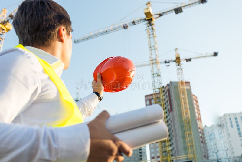 Closeup of Engineer Posing on Building Site with Orange Hardhat Stock ...