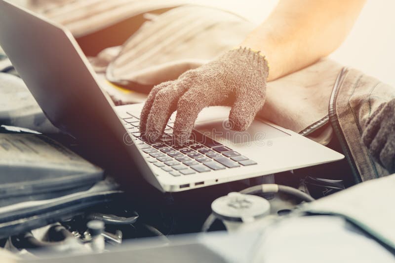 Closeup Engineer Service Professional Using Laptop Computer Tuning Car ...