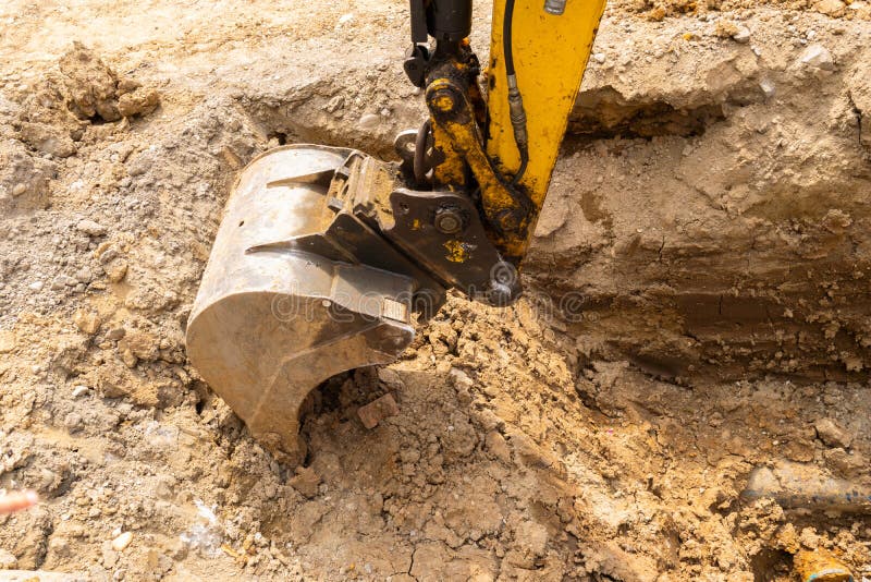 Closeup of an Excavator Claw Scoop Digging a Trench Stock Photo - Image ...