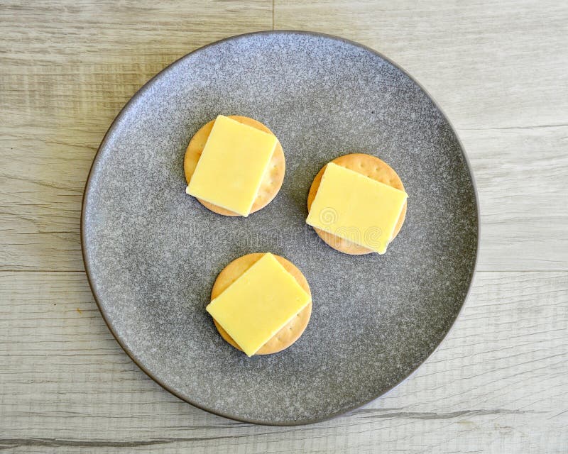 A Top View of Extra Tasty Cheddar Cheese on Cracker Biscuits. Stock ...