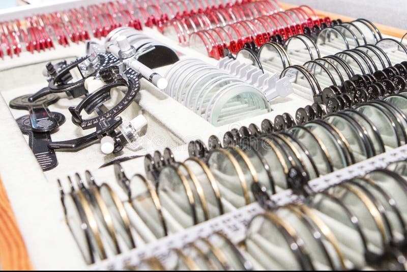 Closeup of Eye Test Glasses on with Box of Many Different Trial Stock ...