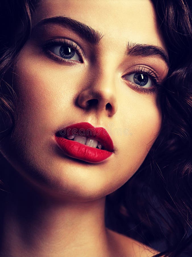 Face Of A Beautiful Woman With A Smoky Eye Makeup And Red Lipstick